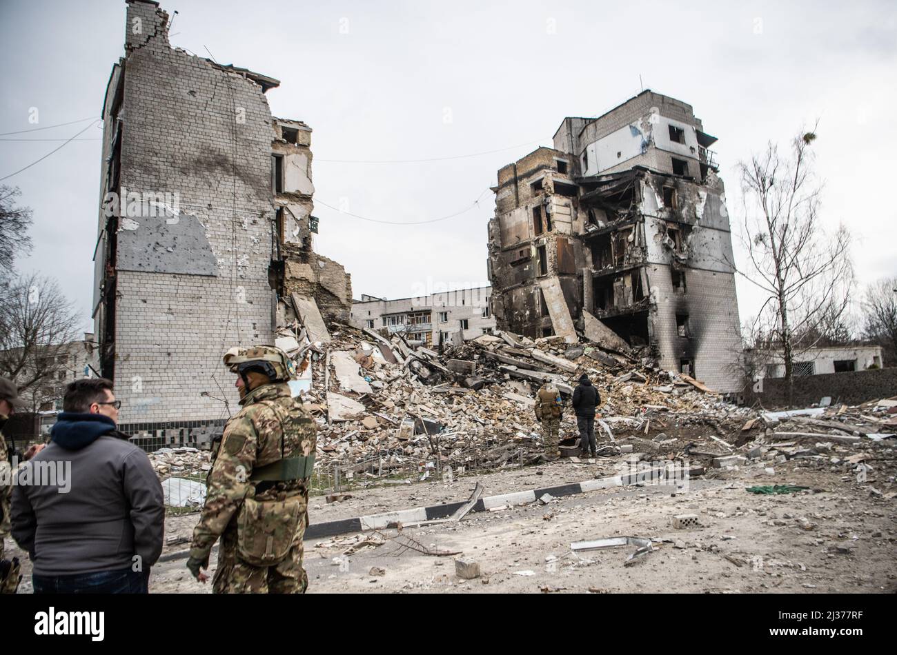 Burned buildings marked with bullet holes and shrapnel fragments show ...