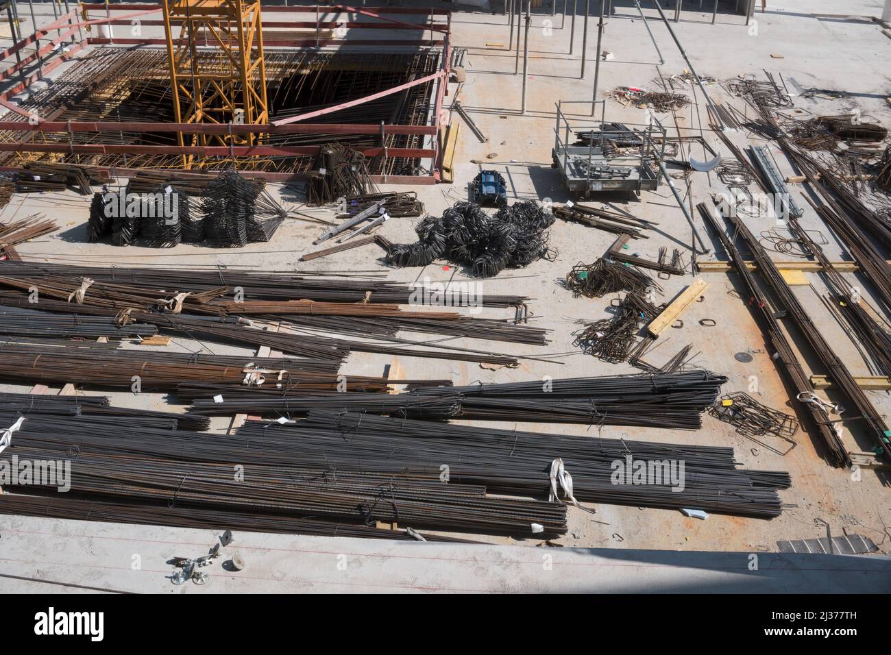 Various structural steel delivered to a large construction site for ...