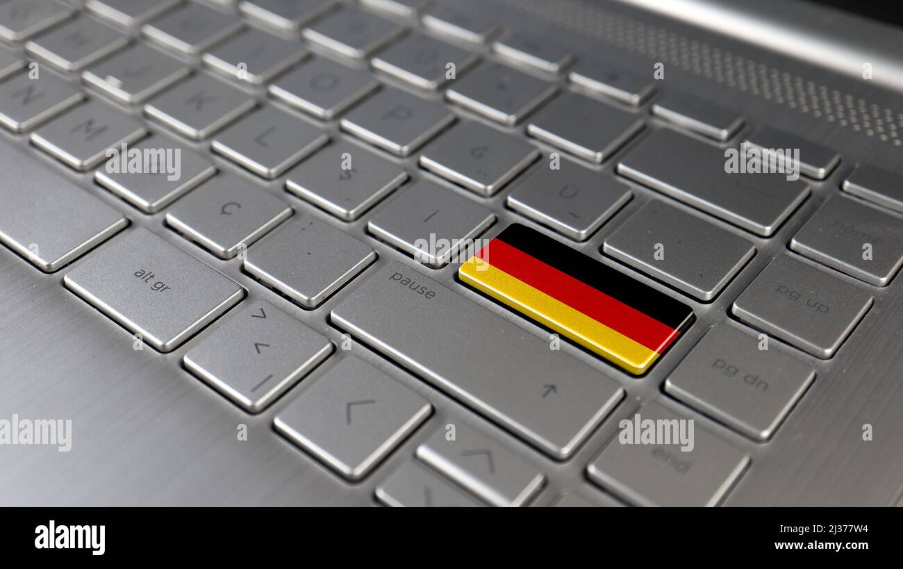 Keyboard with Germany flag on the enter button, represents cyber attack ...