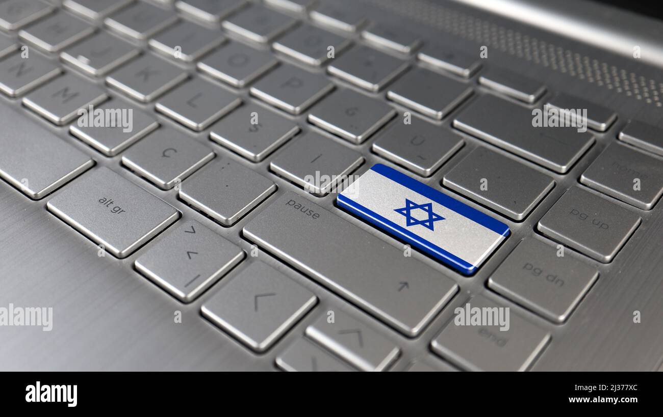 Keyboard with Israel flag on the enter button, represents cyber attack ...