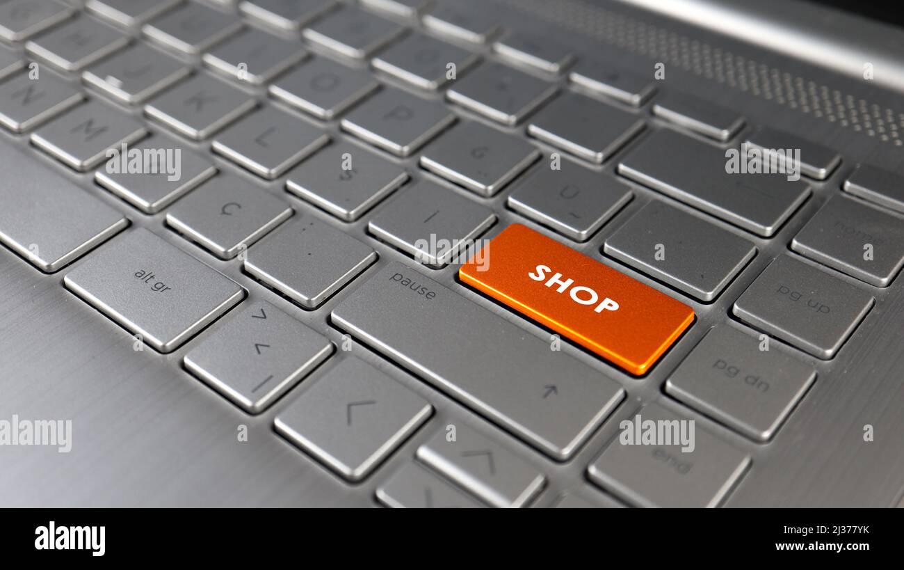 Keyboard with shop text on the enter button, represents shop, metaphor ...