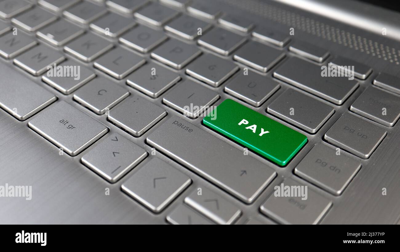 Keyboard with pay text on the enter button, represents pay, metaphor of ...
