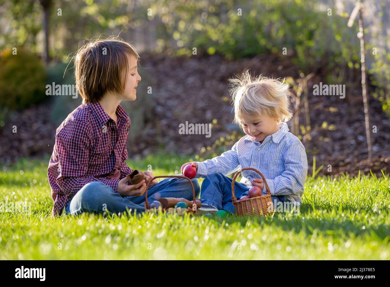 Cute children, eating chocolate bunnies and fighting with easter eggs ...