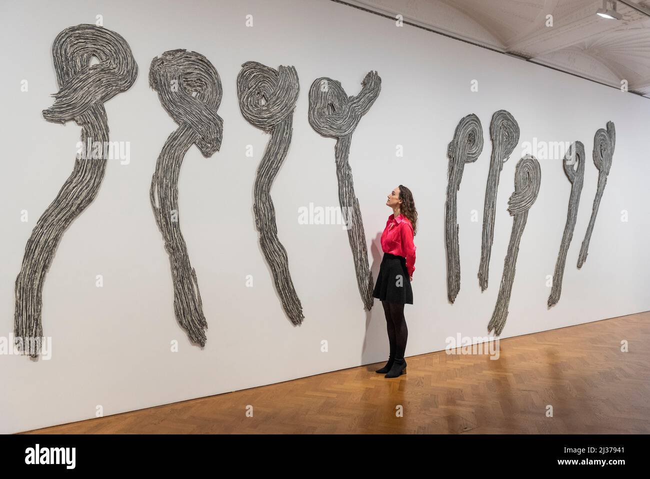 London, UK. 6 April 2022. A staff member poses with "Party of Nine ...