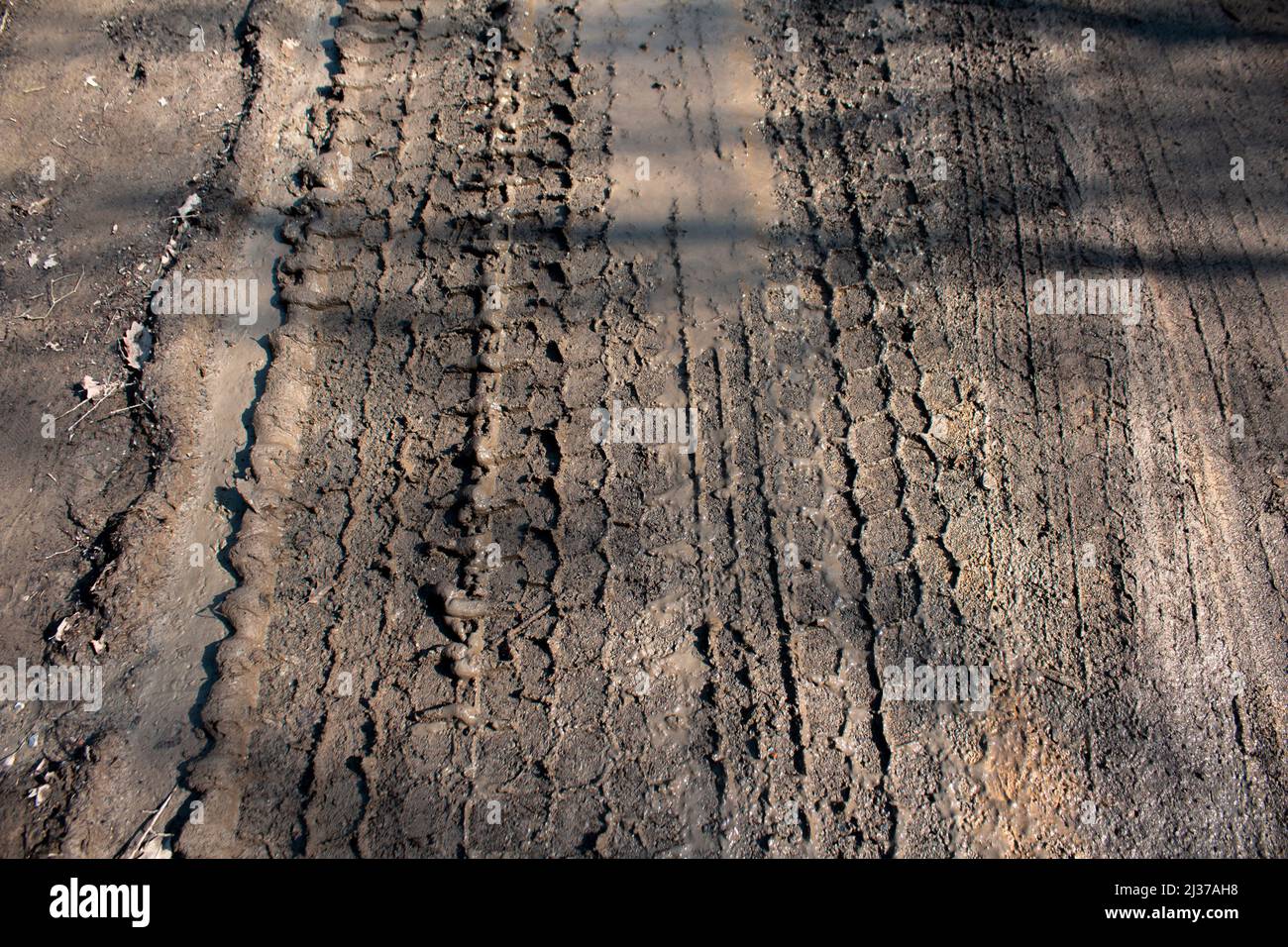 Wheel track on sludgy ground, muddy forest path with truck wheel mark ...