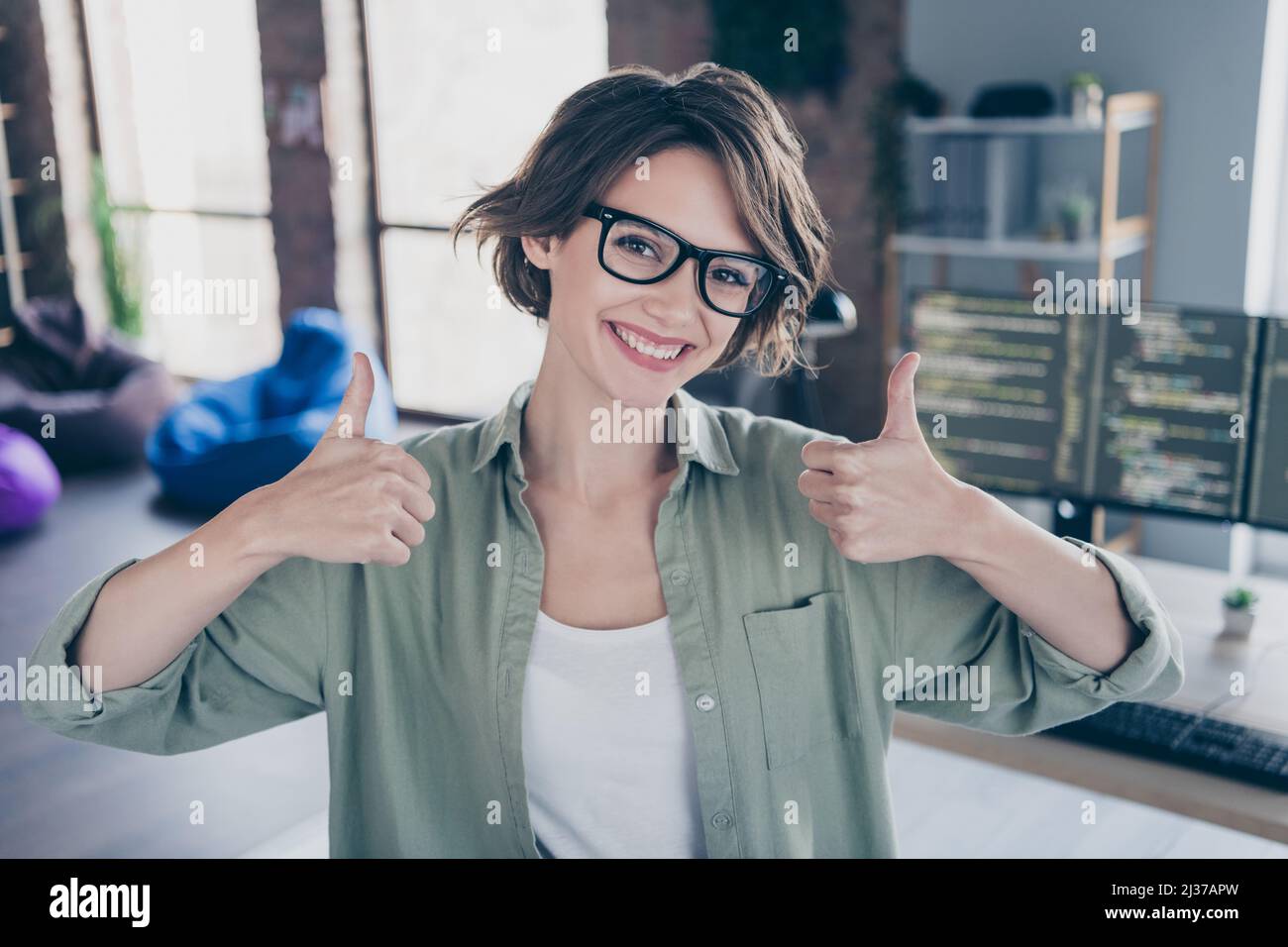 Portrait of smiling server optimization expert two hands show thumb up ...
