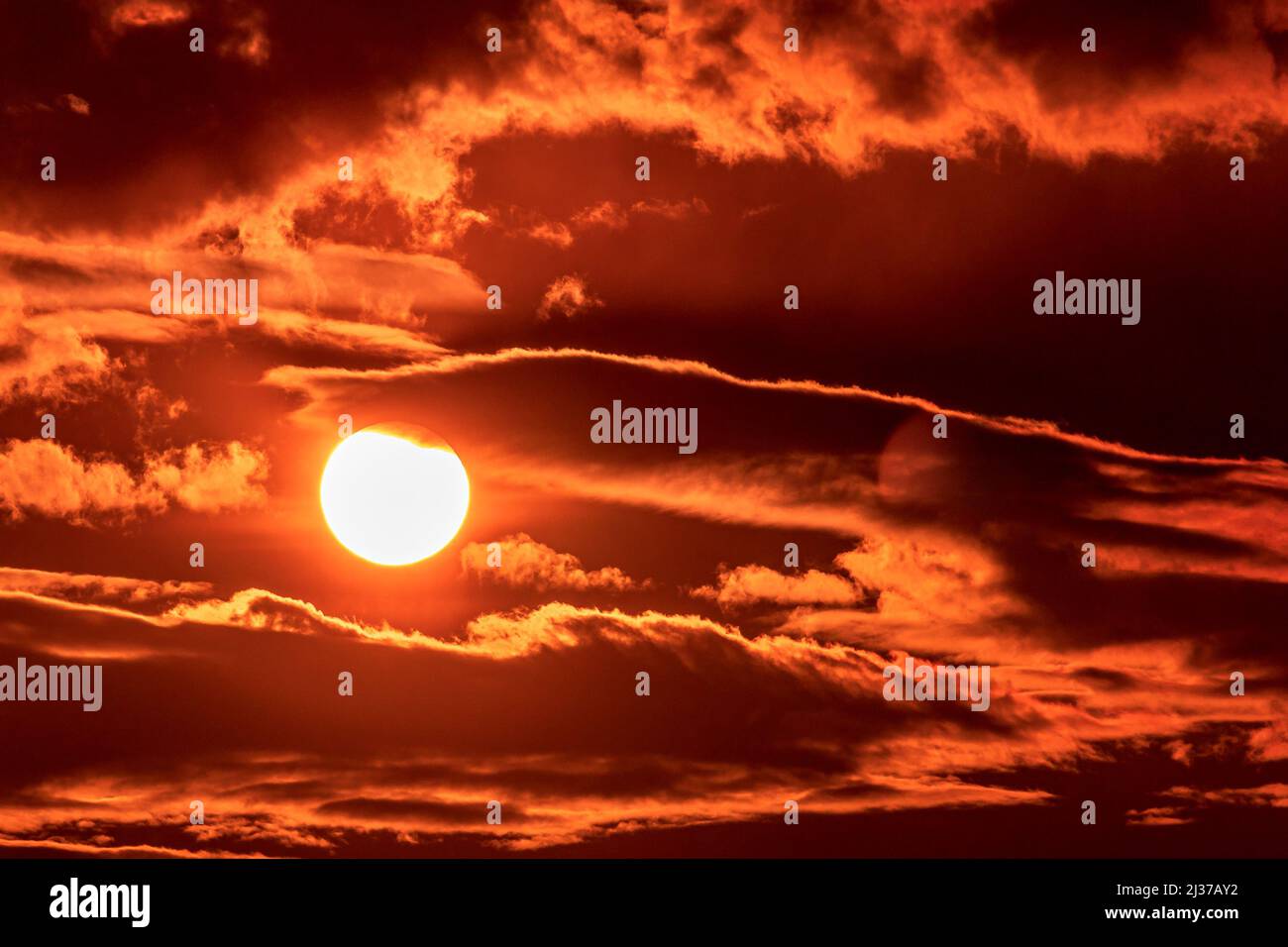 Sun is going down. Beautiful sunset with the Sun between the clouds ...