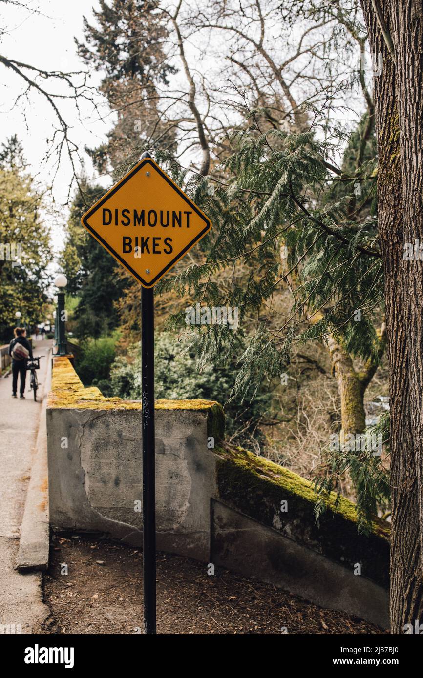 yellow Dismount Bikes road traffic sign in the Arboretum, Seattle, WA ...