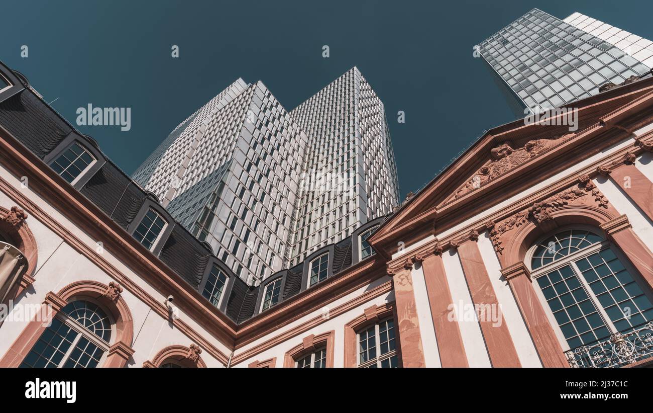 A low angle shot of a modern building with glass windows Stock Photo ...