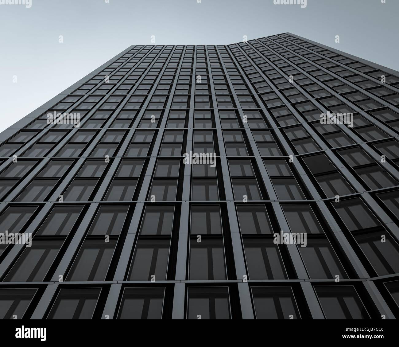 A low angle shot of a modern building with glass windows Stock Photo ...