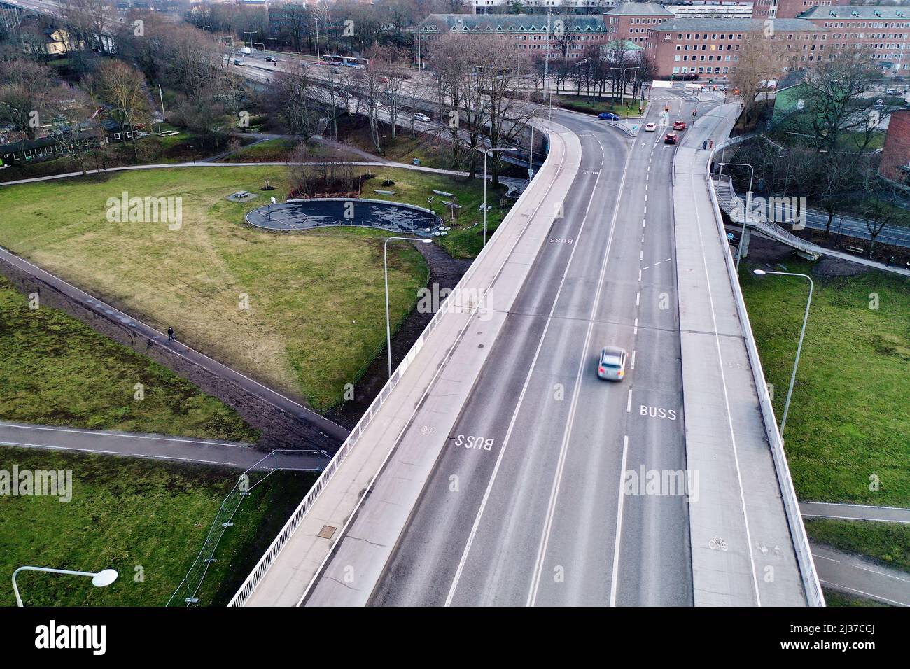 An aerial view of the cars passing over the highway bridge Stock Photo ...