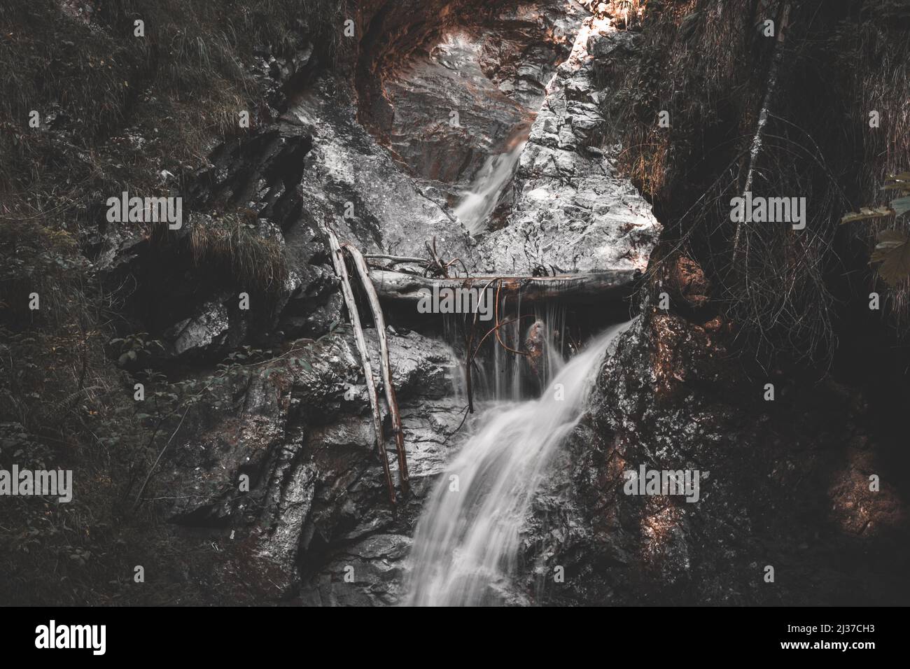 A beautiful landscape view of waterfall between rocks in the mountain ...