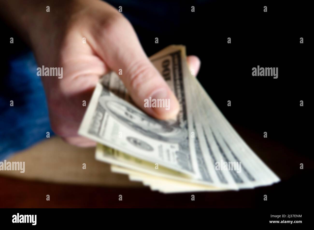 Blurred. Hands passing money under table corruption bribery Stock Photo ...
