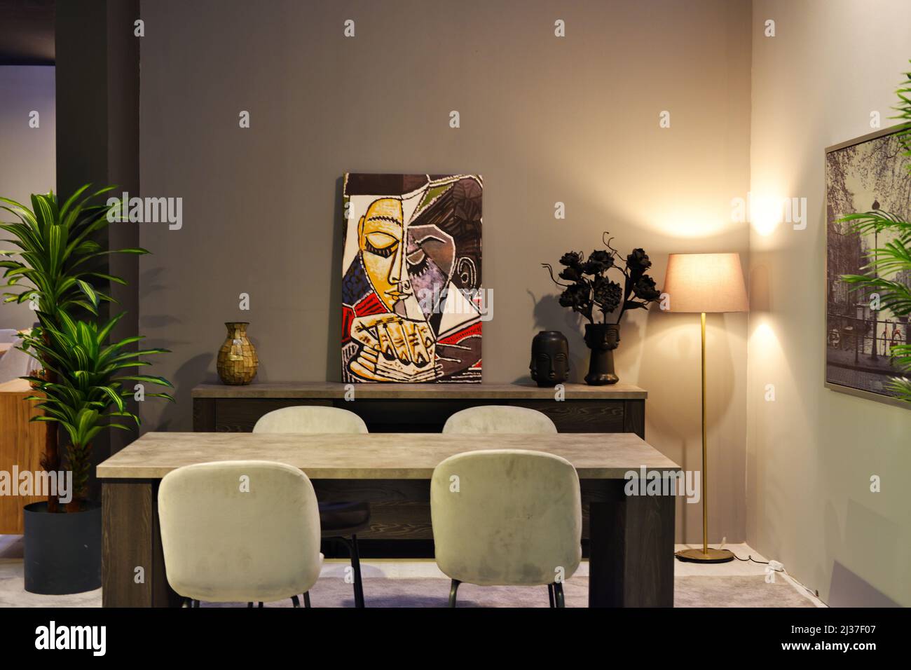 Table and Chairs at Decorative Dining Room with paintings, floor lamp ...