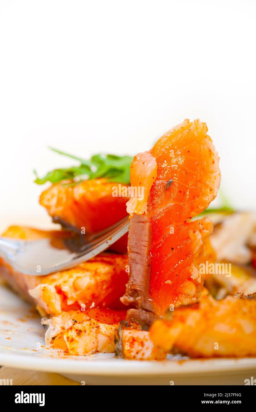 grilled fresh samon filet with vegetables salad tomato arugula ...