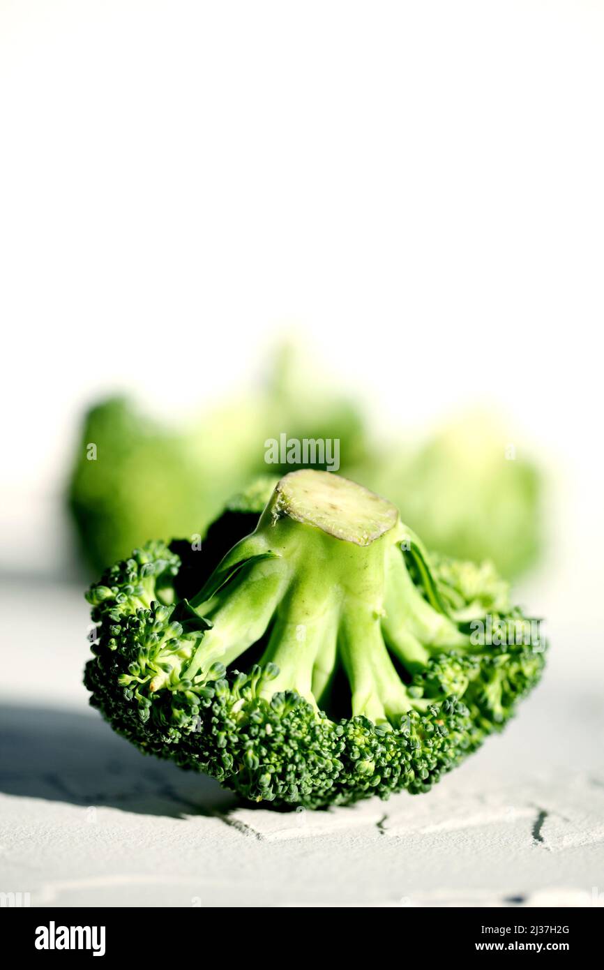 Close-up of raw broccoli branch on white background Stock Photo - Alamy