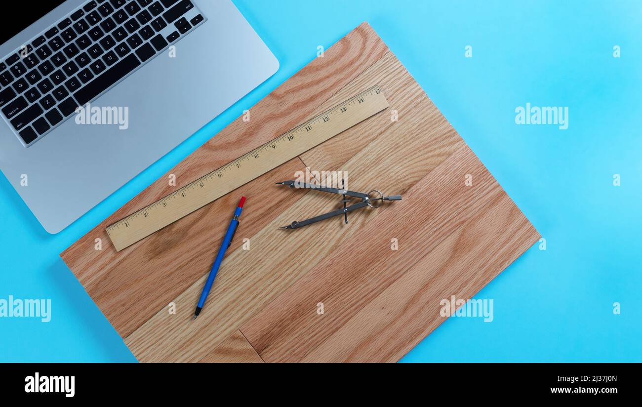 Blue desktop with architect designer tools consisting of ruler ...