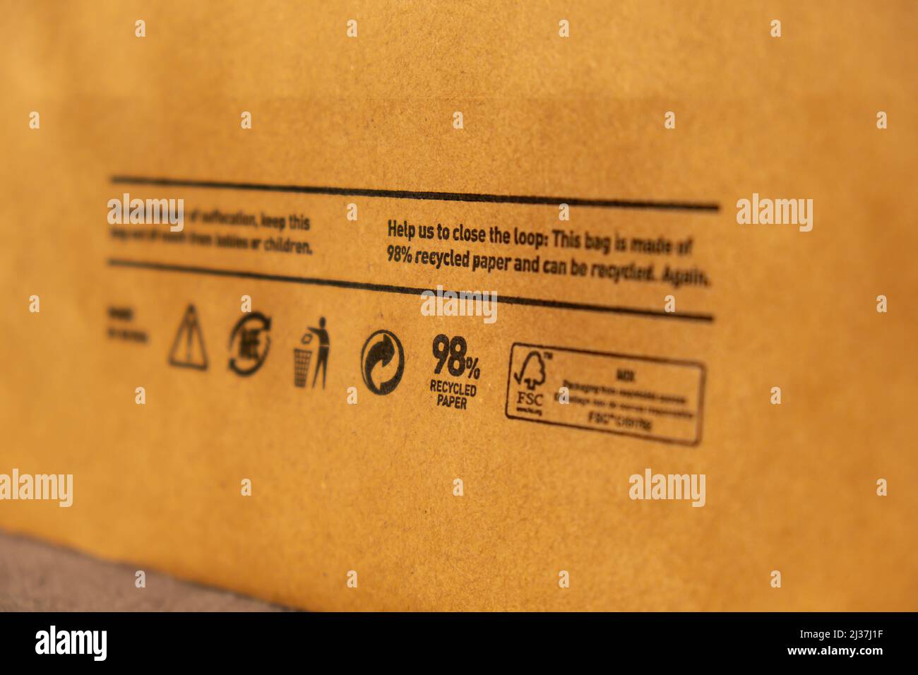 Recycling bag Closeup view of pap sign and other eco-label on Brown ...