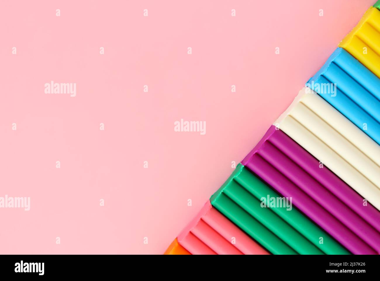 Bricks of colorful modeling clay lying diagonally in the corner of the ...