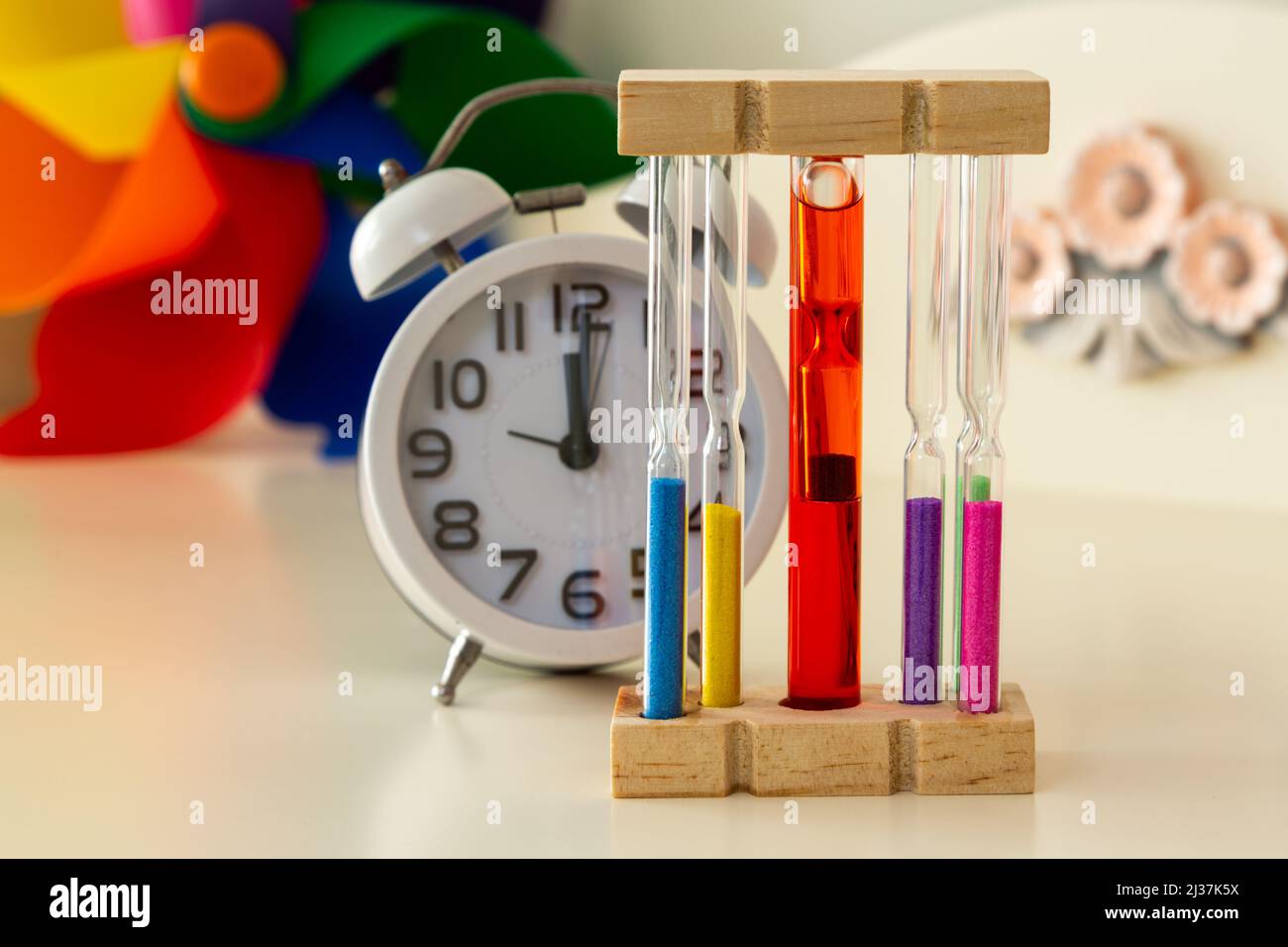 Decorative hourglass in selective focus. Out of focus classic alarm ...