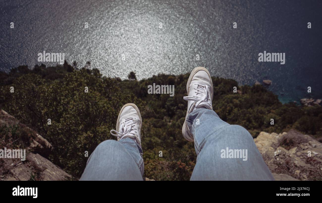Legs over cliff hi-res stock photography and images - Alamy