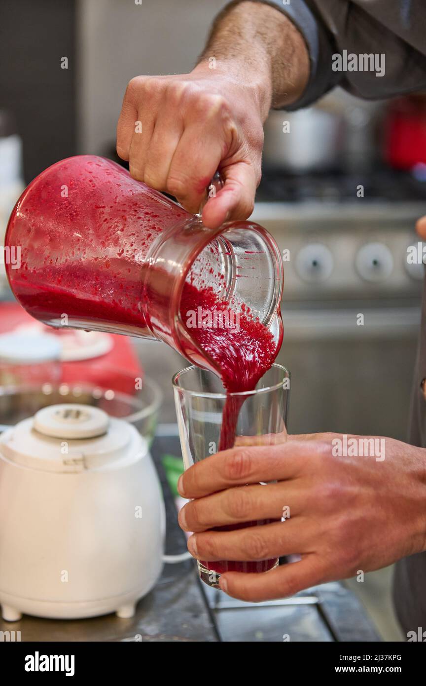 Serving fruit juice with beetroot from a crystal pitcher Stock Photo ...