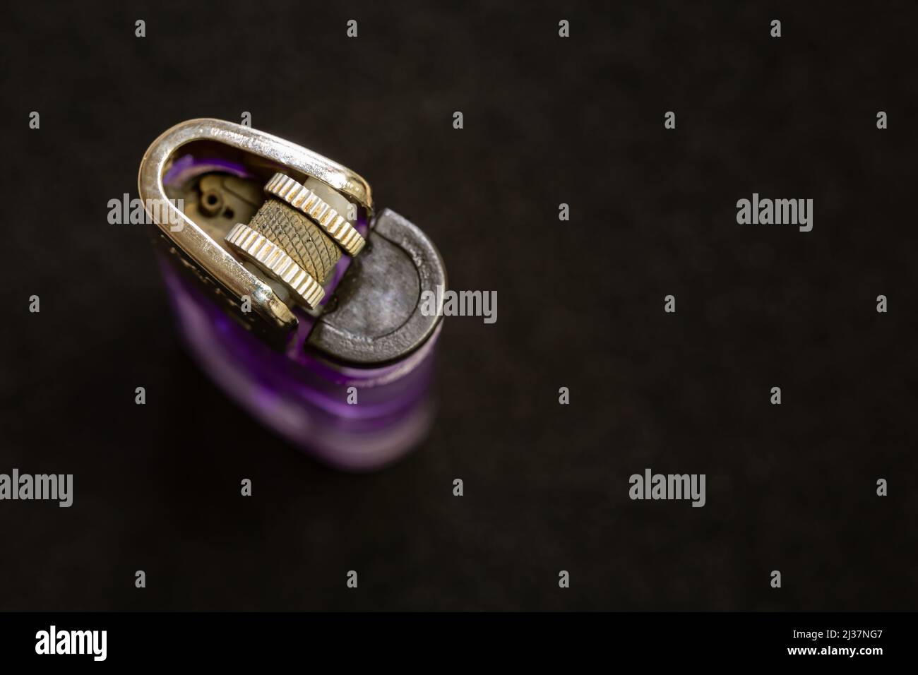 Lighter top view. Lighter with transparent purple plastic gas chamber ...