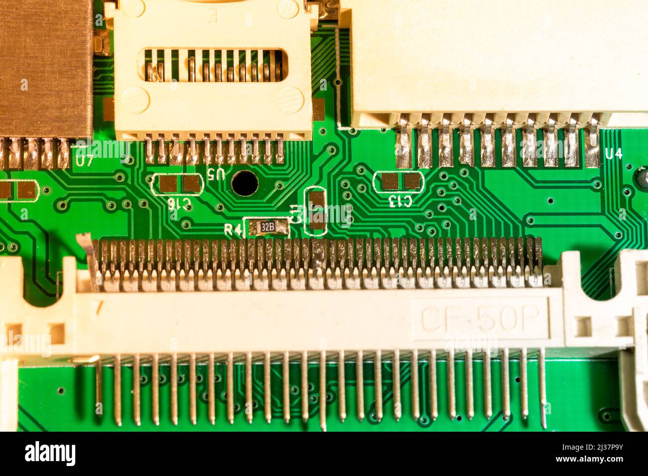 PCB board top view of a CF, micro SD and SD card reader. Macro ...