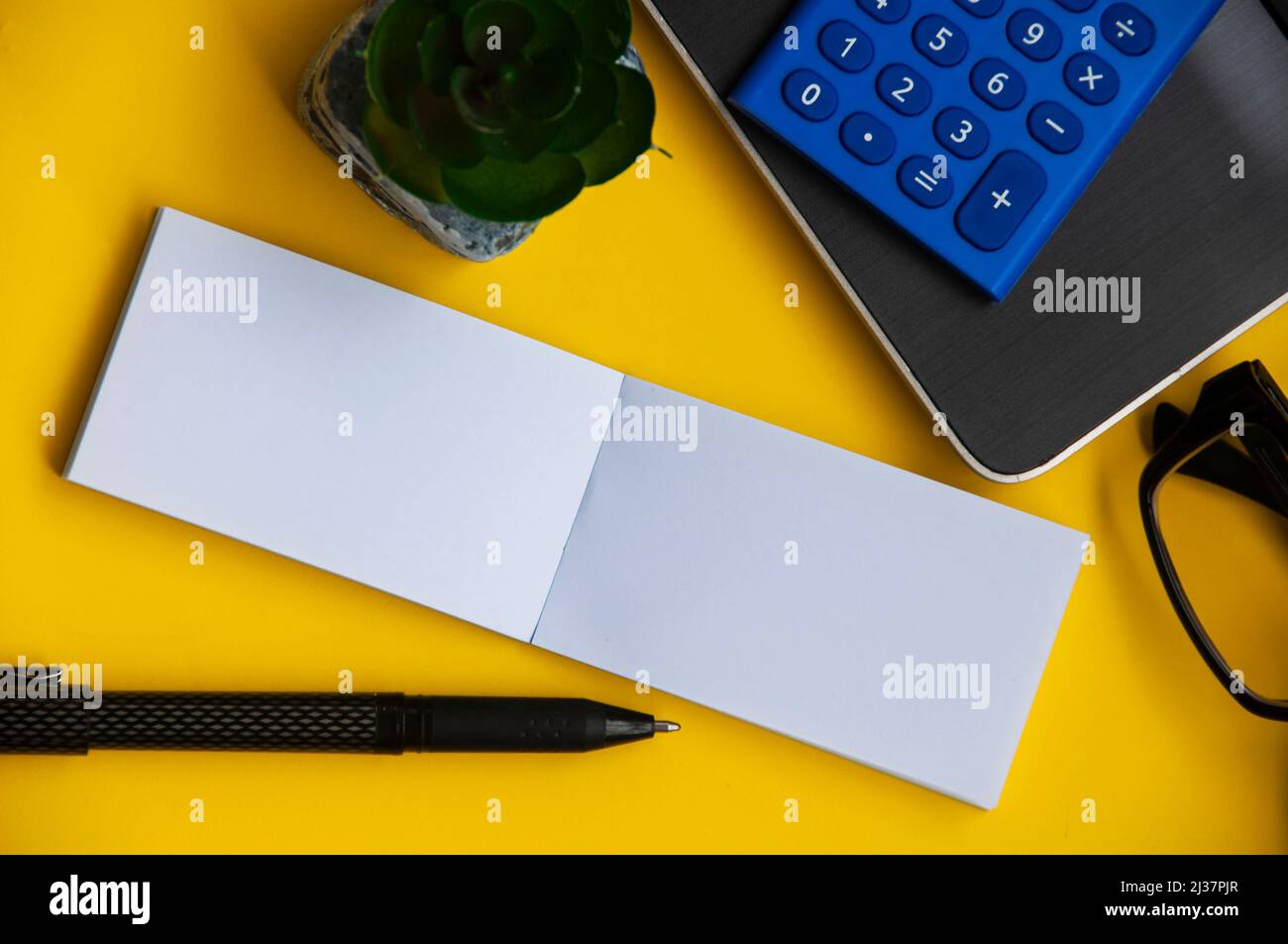 Top view of blank notepad with office setting background. Copy space ...