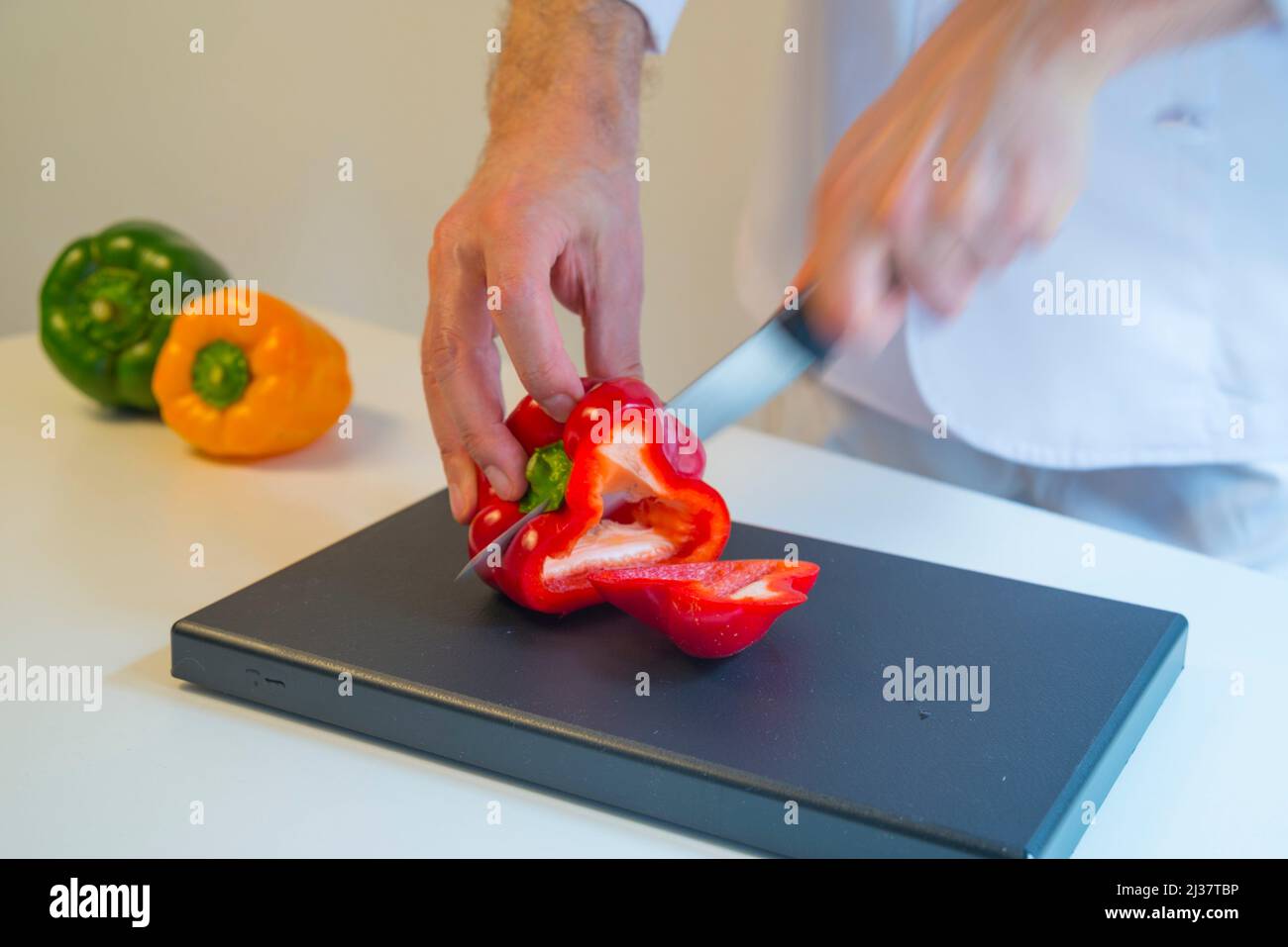 Chef knife cutting hi-res stock photography and images - Alamy