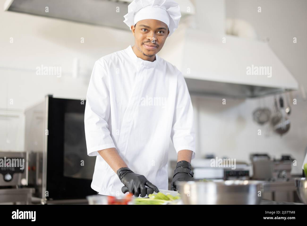 Hispanic man cooking hi-res stock photography and images - Alamy