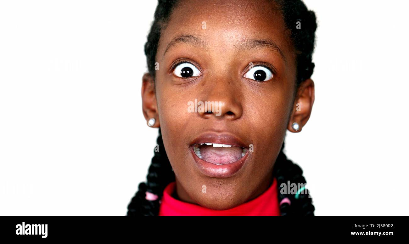 African girl surprise reaction, black teen young woman close-up face ...