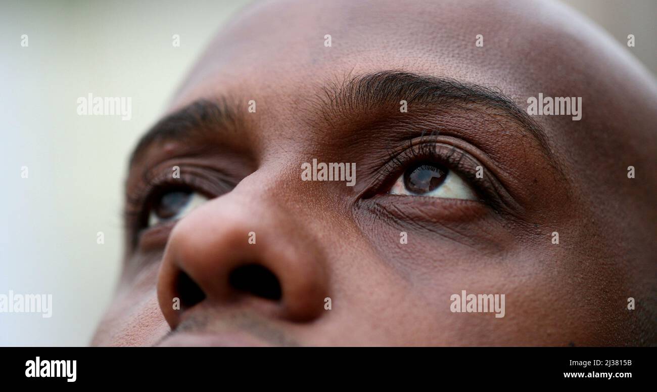 African man opening eyes close-up, black ethnicity person eye open ...