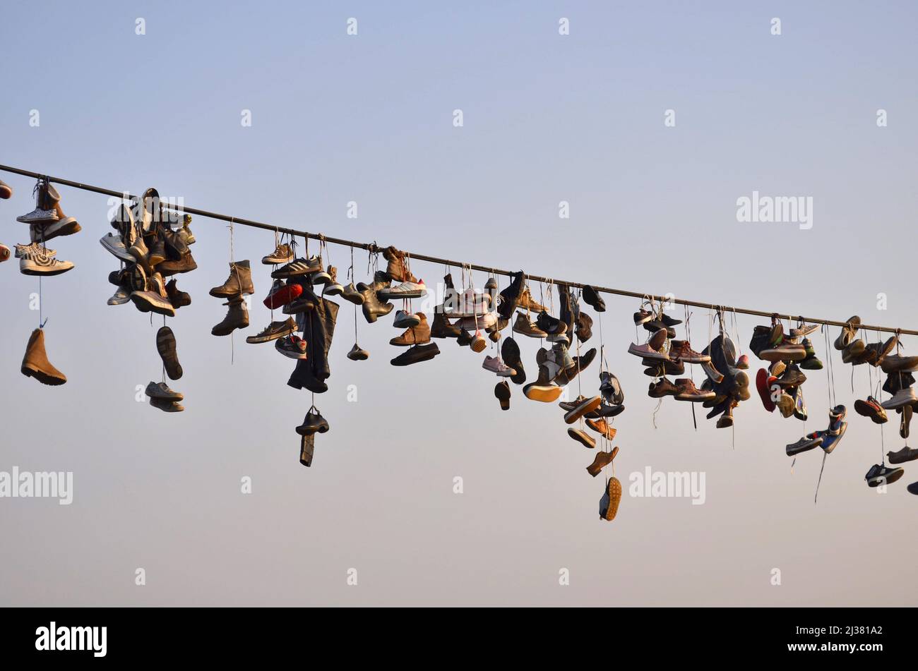 Dangling shoes hi-res stock photography and images - Alamy