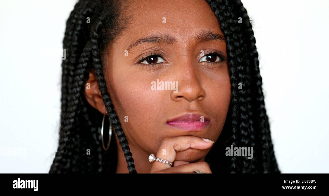 Pensive black African girl thinking, portrait teen daydreaming ...