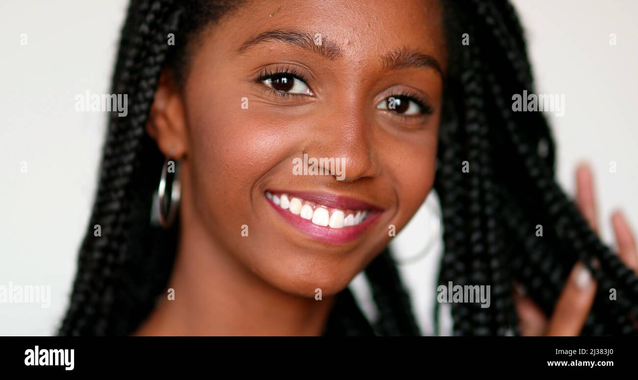 Pretty black African girl posing to camera. Teenager young woman ...