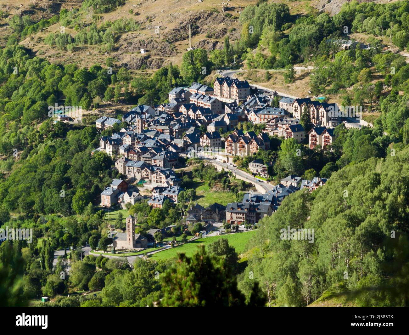 Summer aerial view of Taül village, with St Clement Romanesque Church ...