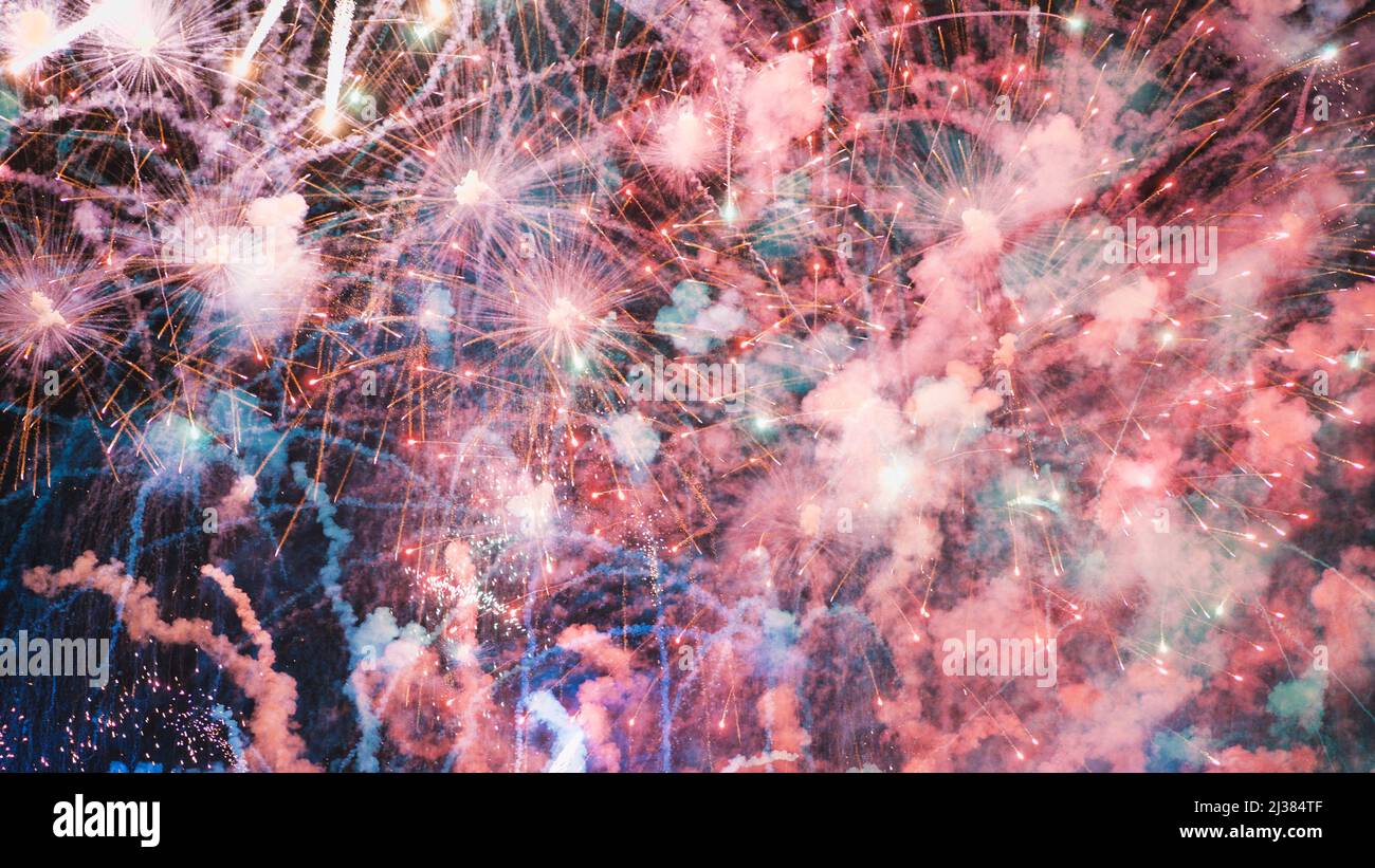 A colourful explosion of fireworks in the night sky Stock Photo - Alamy