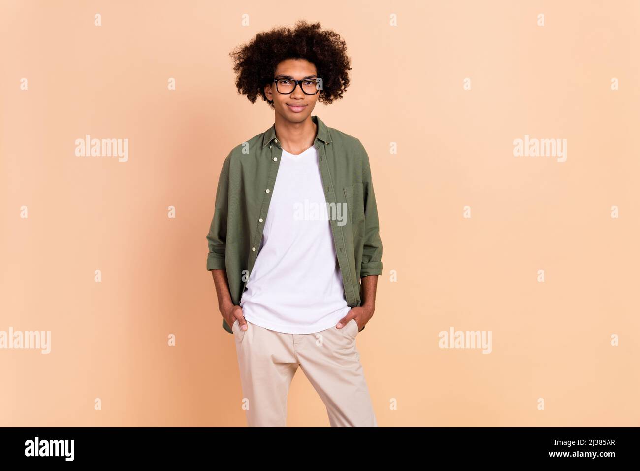 Portrait of attractive content skilled intellectual guy geek holding ...