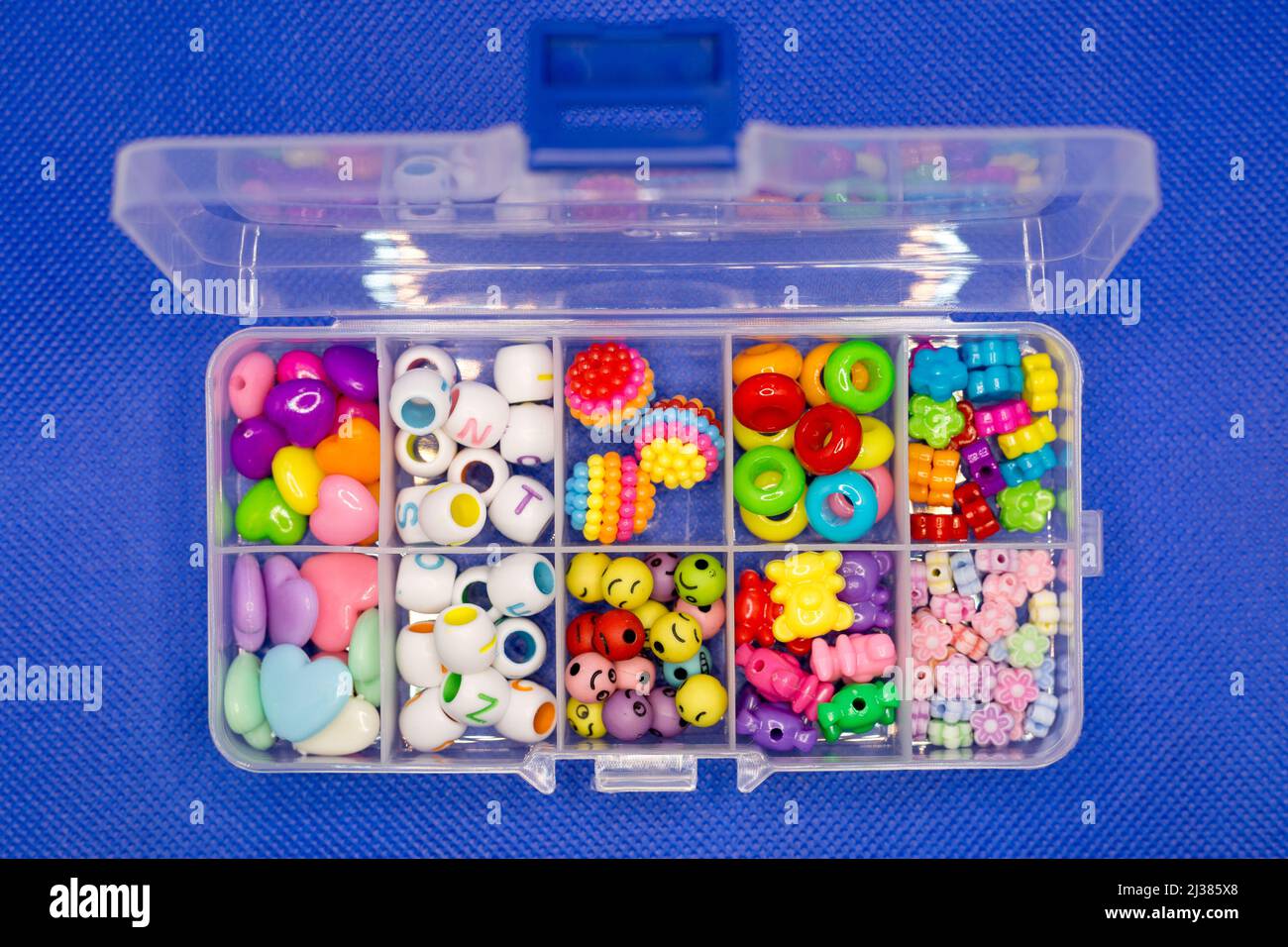 Plastic container with colored round buttons jewelry for clothes ...