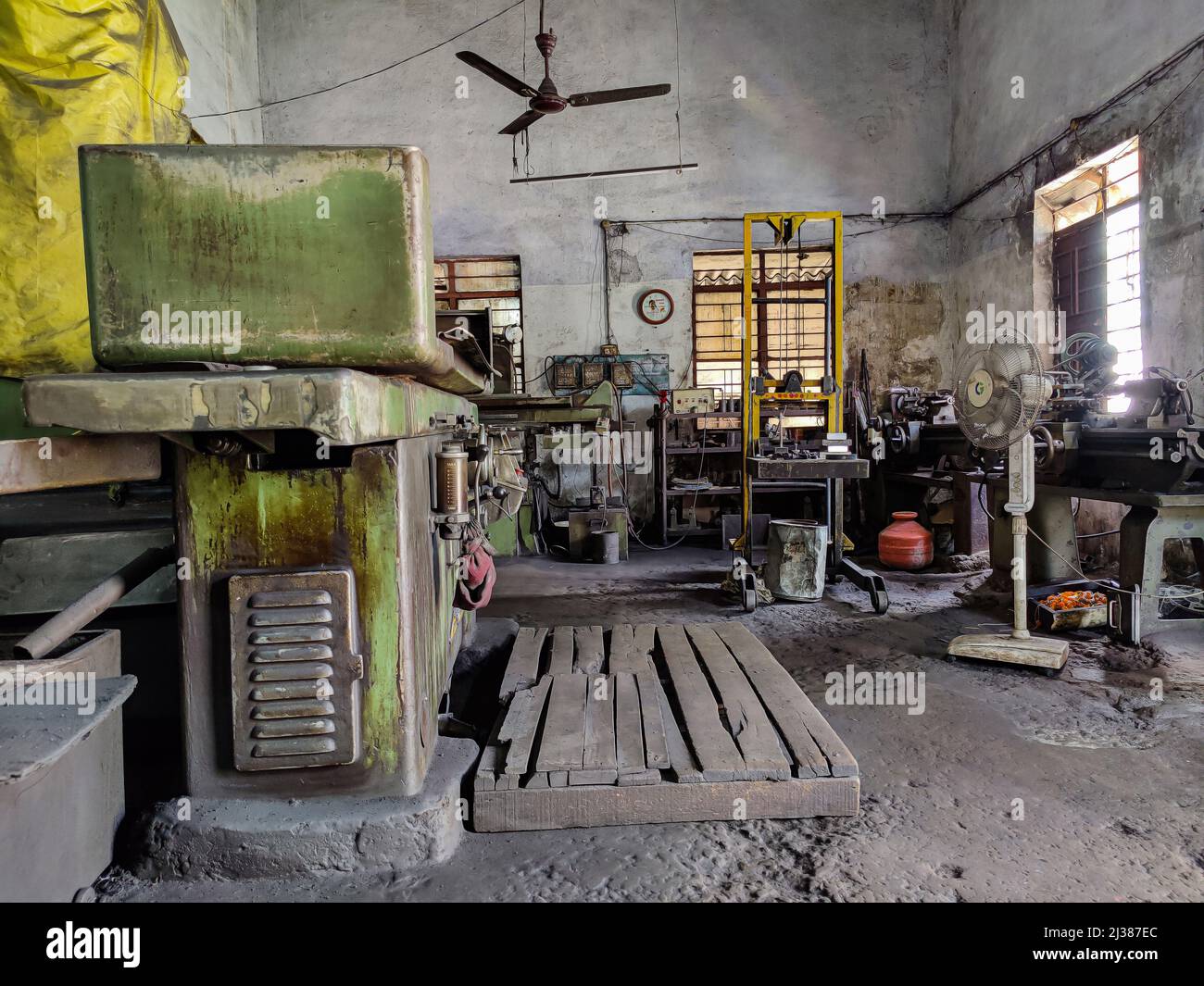 The industrial factory interior with grinding surface machines, other ...