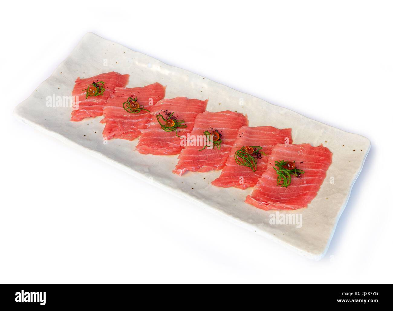 A closeup of a traditional Japanese mole carpaccio on a plate isolated ...