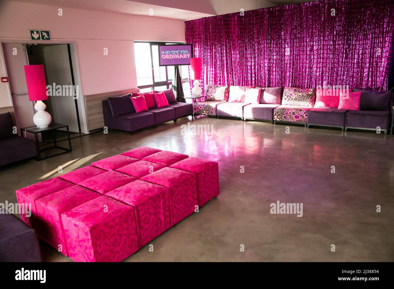 The purple themed decor at indoor media party event Stock Photo - Alamy