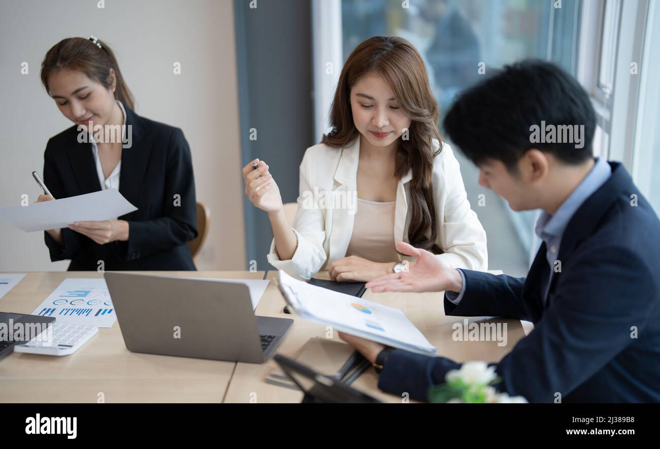 Young asian business group with the creative work, talk and exchange ...