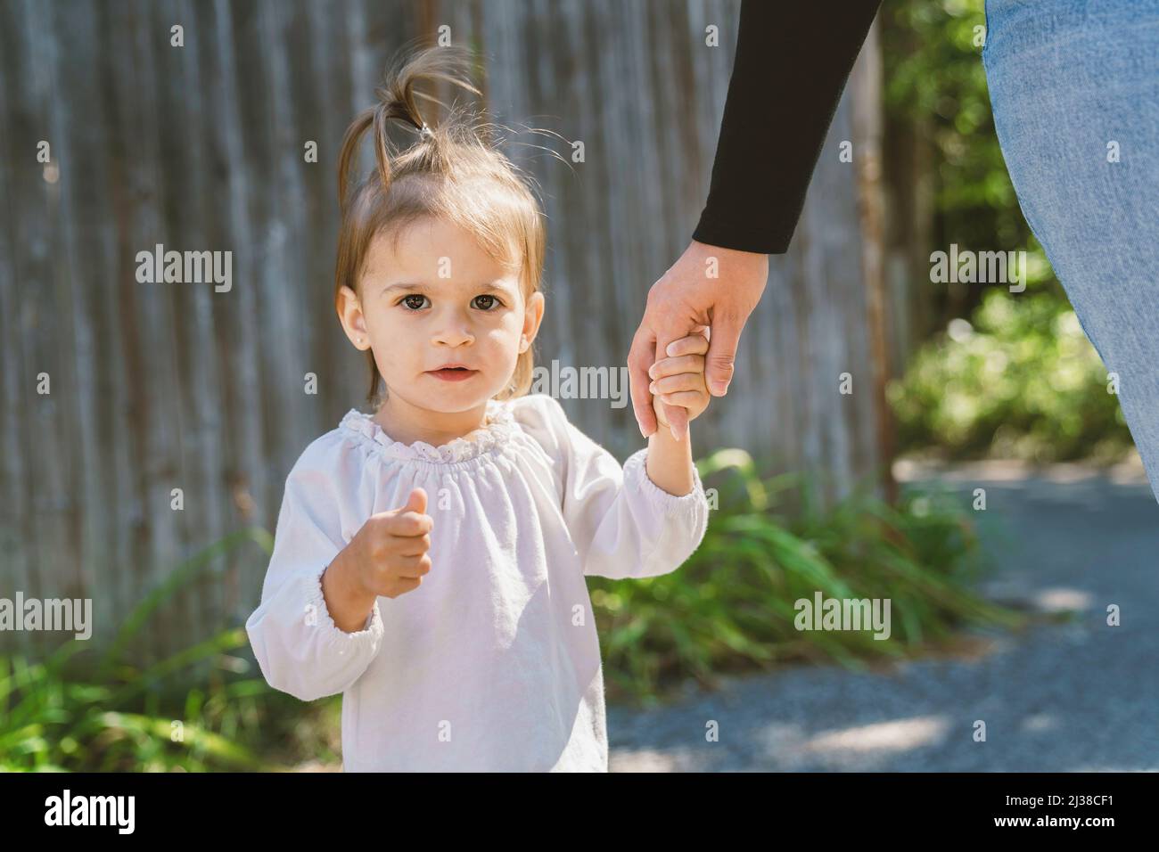 Nice and Cute little two years girl outside Stock Photo - Alamy