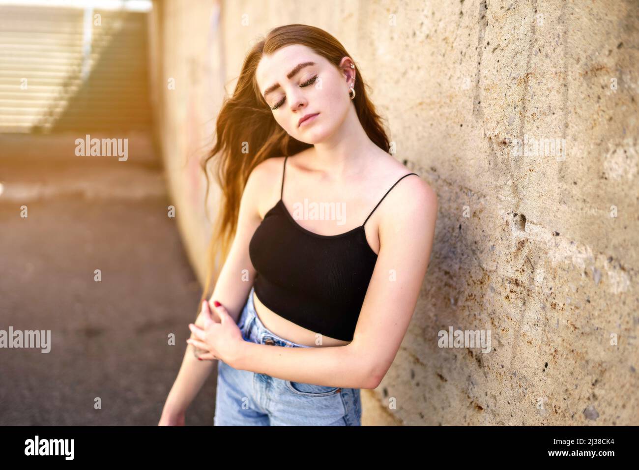 Nice and cool teen girl standing portrait on concreate place Stock ...