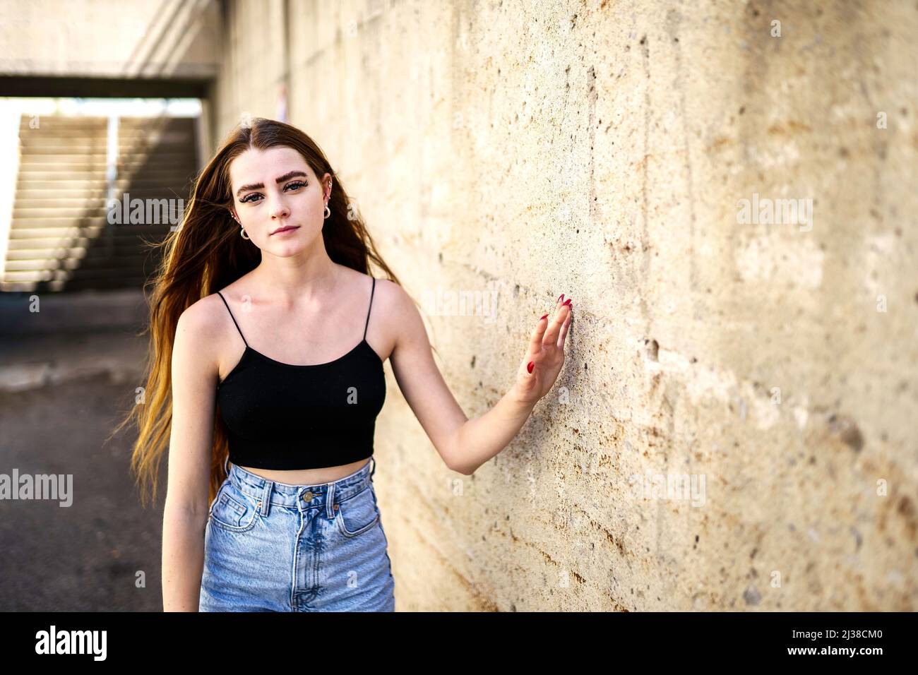 Nice and cool teen girl standing portrait on concreate place Stock ...