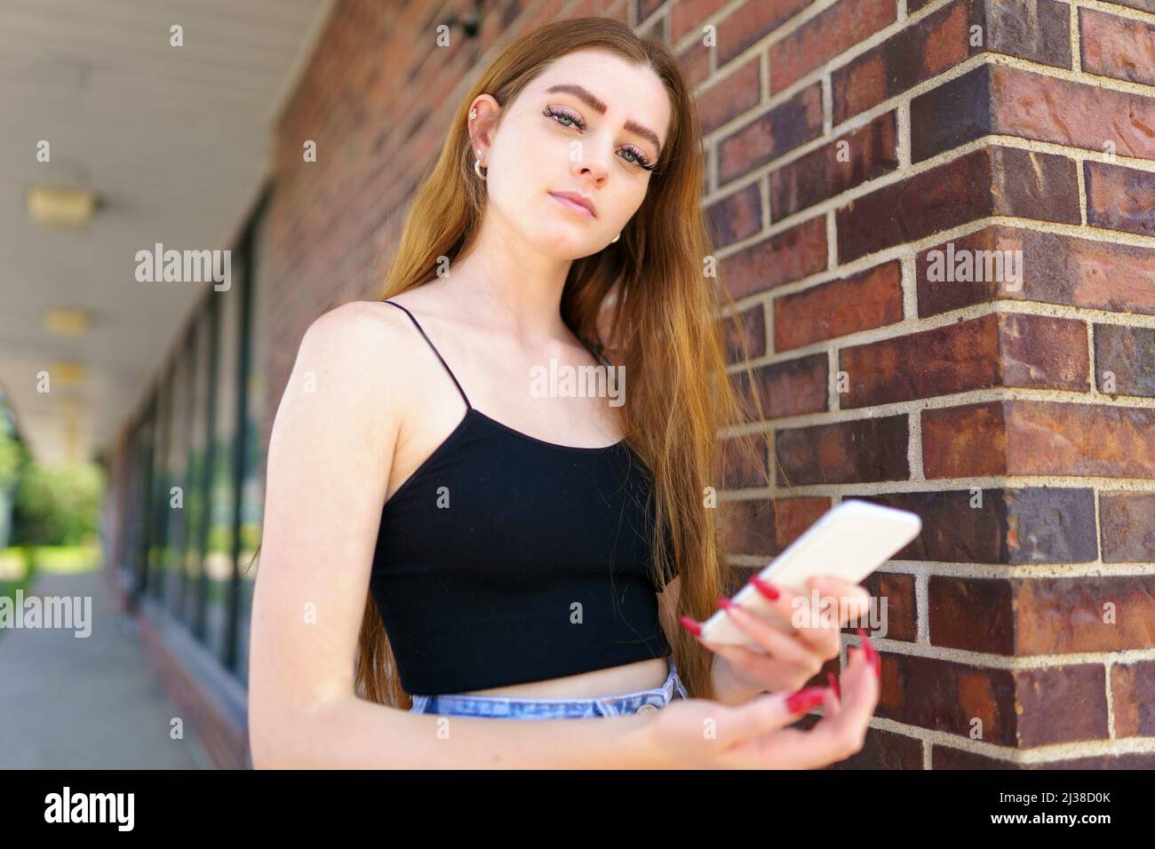 Nice and cool teen girl standing portrait Stock Photo - Alamy