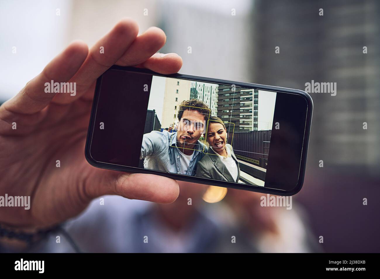 Making some memories. Portrait of two cheerful young work colleagues ...