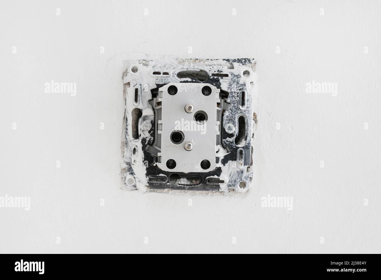 AC power plug during the instalation on the wall. Repair time Stock ...